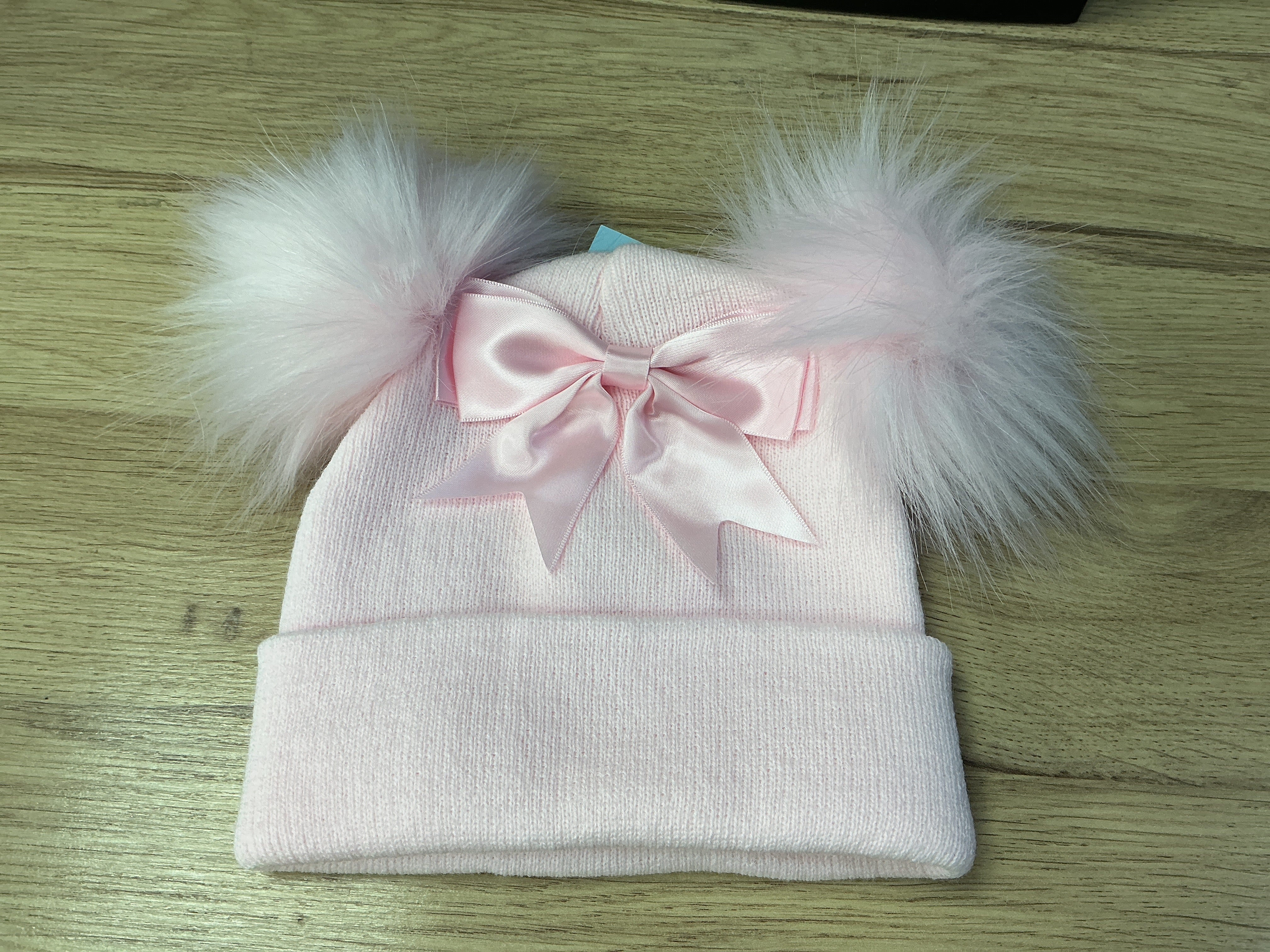 Pink ribbed hat with pink faux pom Poms ,large bow and turnover – Truly ...